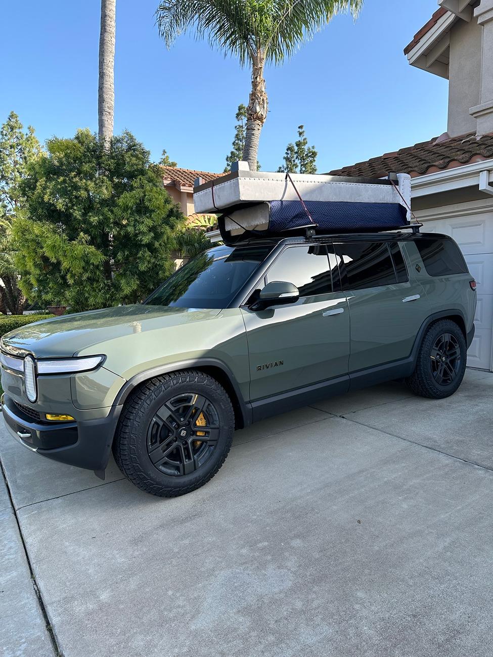 FYI - You can fit an 84" sofa in the back of a R1S and close all doors ...