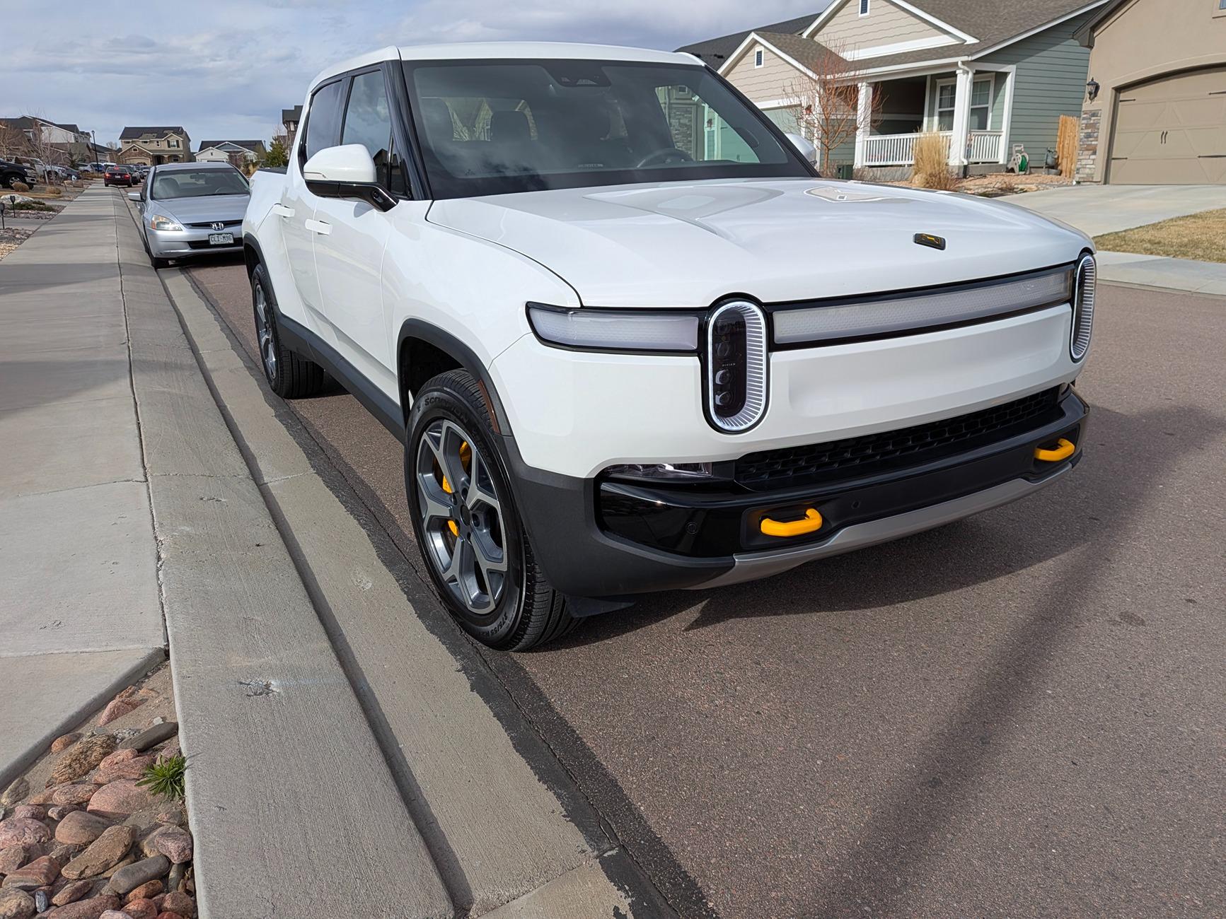 Installed abstract ocean emblems and twraps headlight tint | Rivian ...