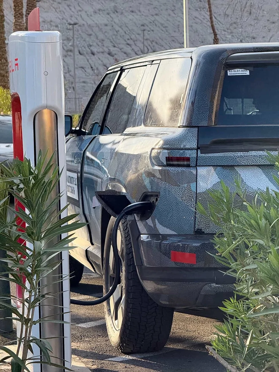 R2 spotted charging via NACS port at Tesla Supercharger | Rivian Forum ...