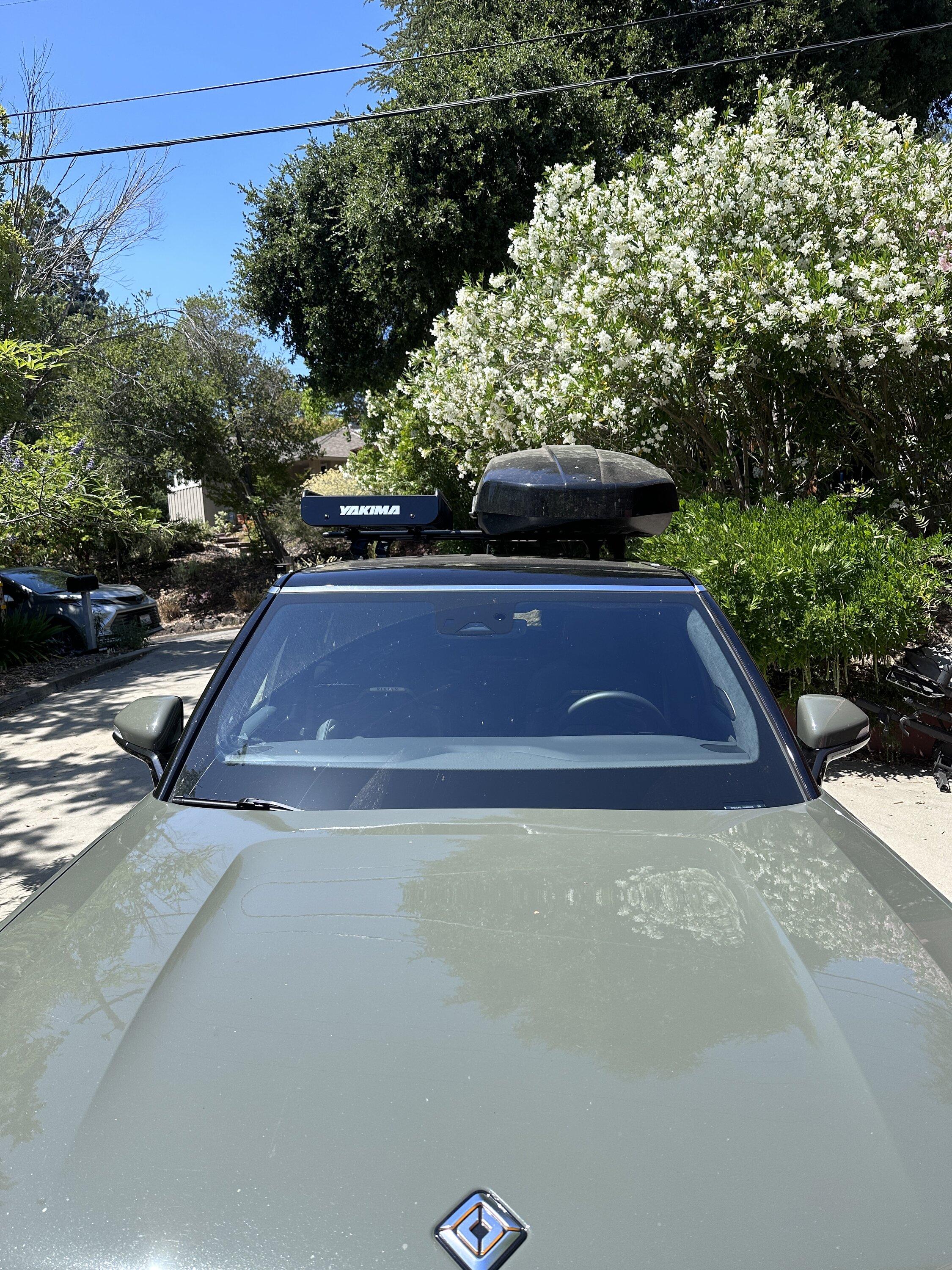 Thule roof rack, box and cage installed on R1S for road trip | Rivian ...