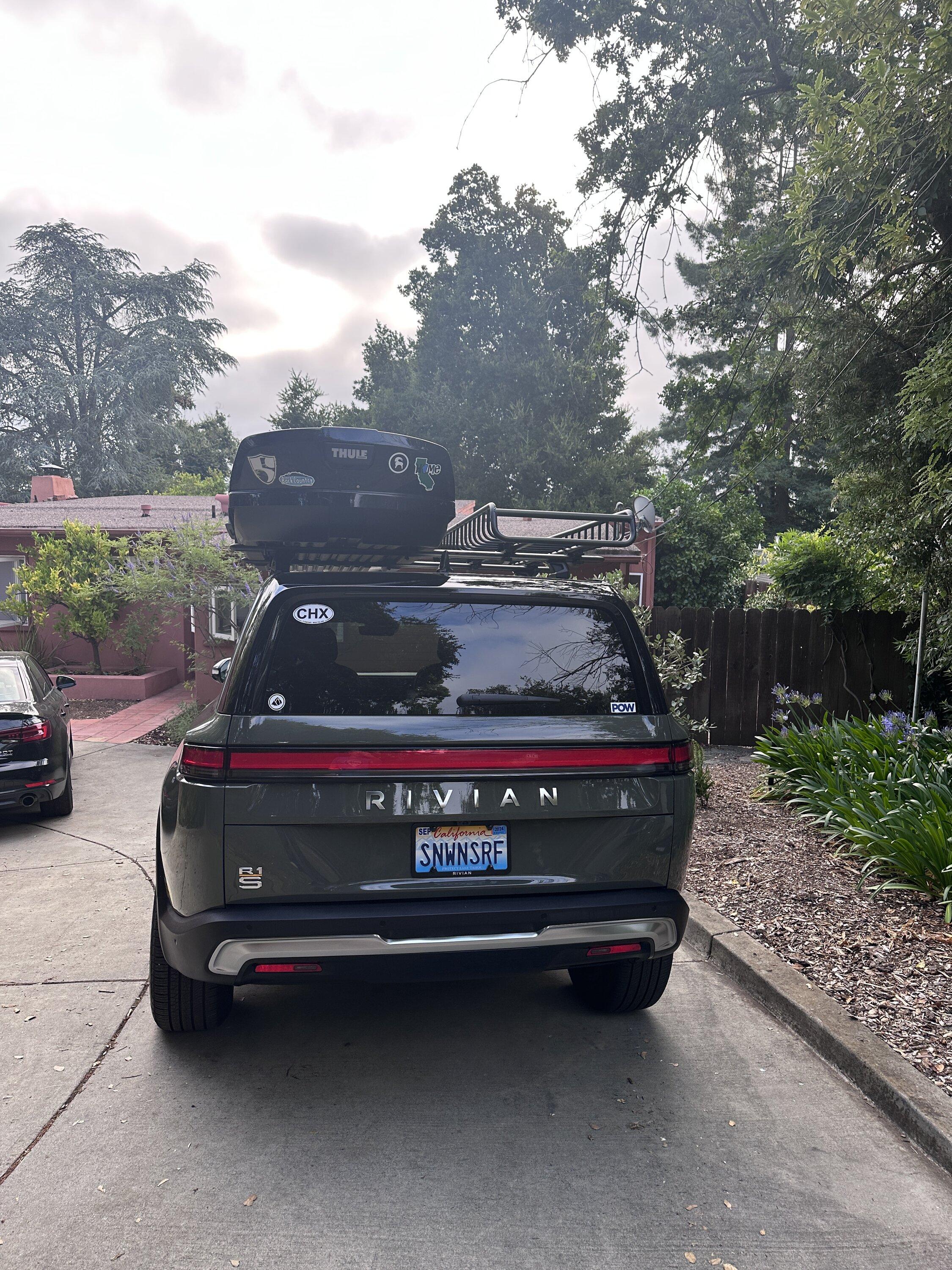 Thule roof rack, box and cage installed on R1S for road trip | Rivian ...