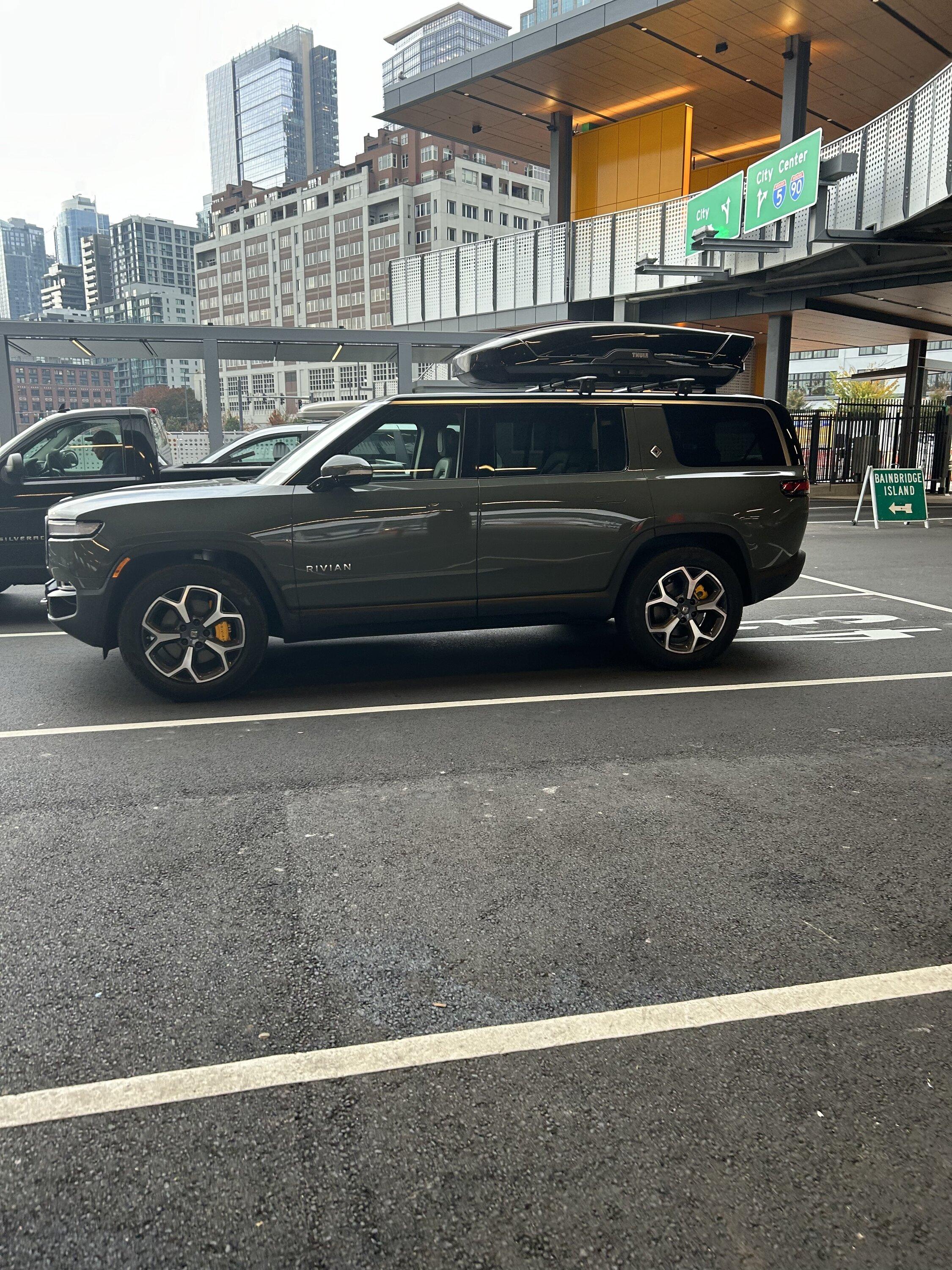 Thule Motion XT XL cargo box fits well on R1S roof crossbars | Rivian ...