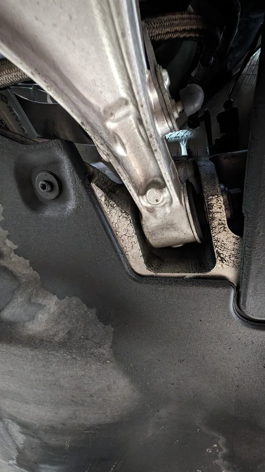 Leaking (hydraulic?) fluid above rear control arm pivot point. | Rivian ...